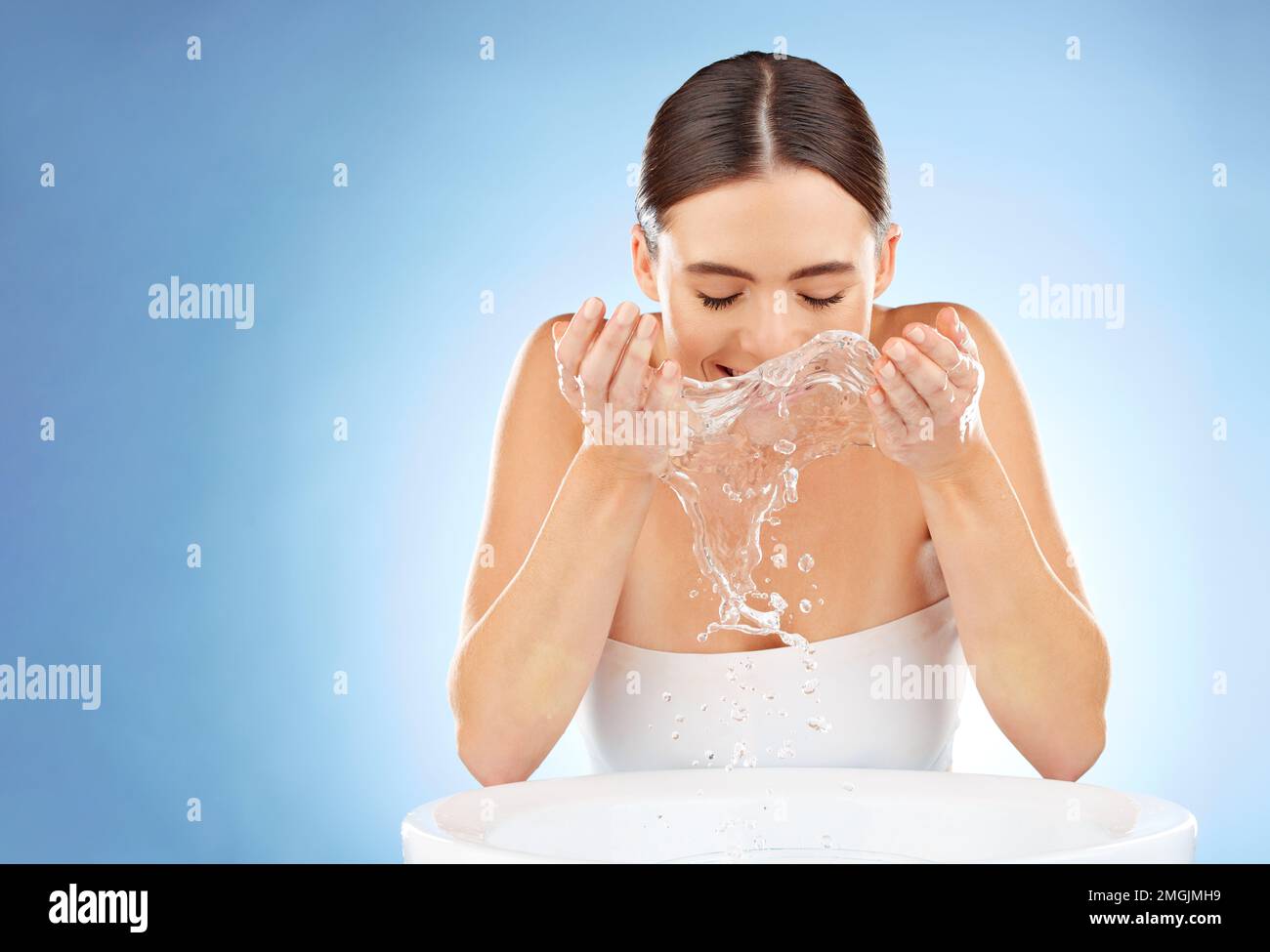 Woman, beauty and water splash for clean face or skin with natural ...