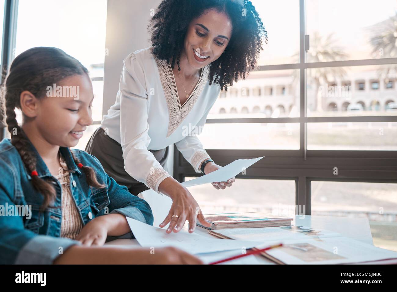 Help, education or teacher teaching a student in a classroom with ...