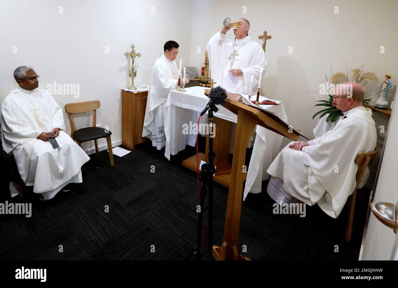 Bishop Paul Martin of the Catholic Diocese of Christchurch, center ...