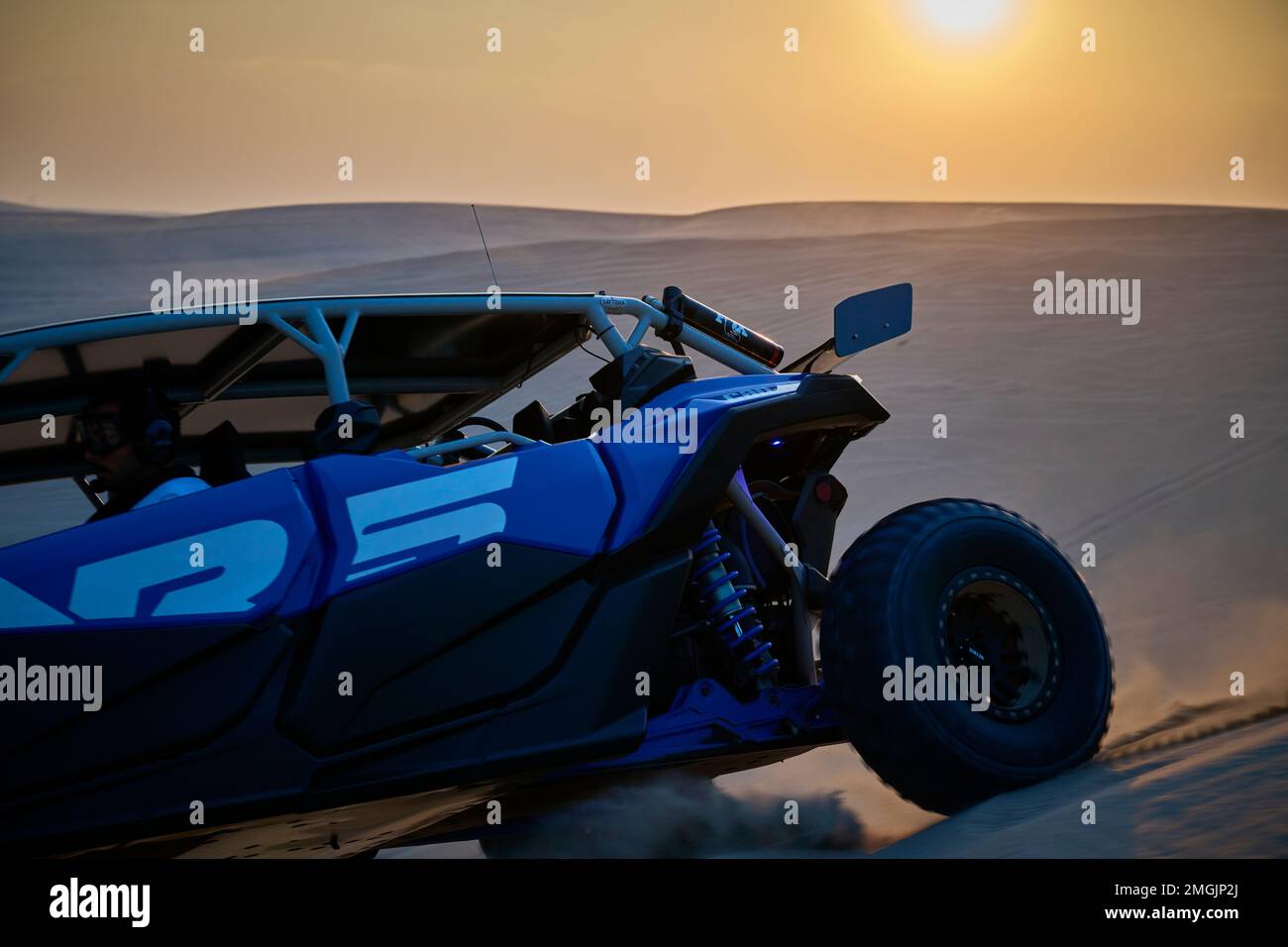 A 4x4 buggy racing over the dunes near Doha, where tourists and Qataris ...