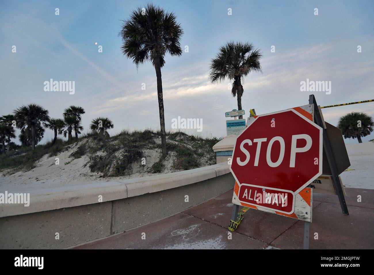 A stop sign blocks the entrance to Clearwater Beach at sunrise on ...