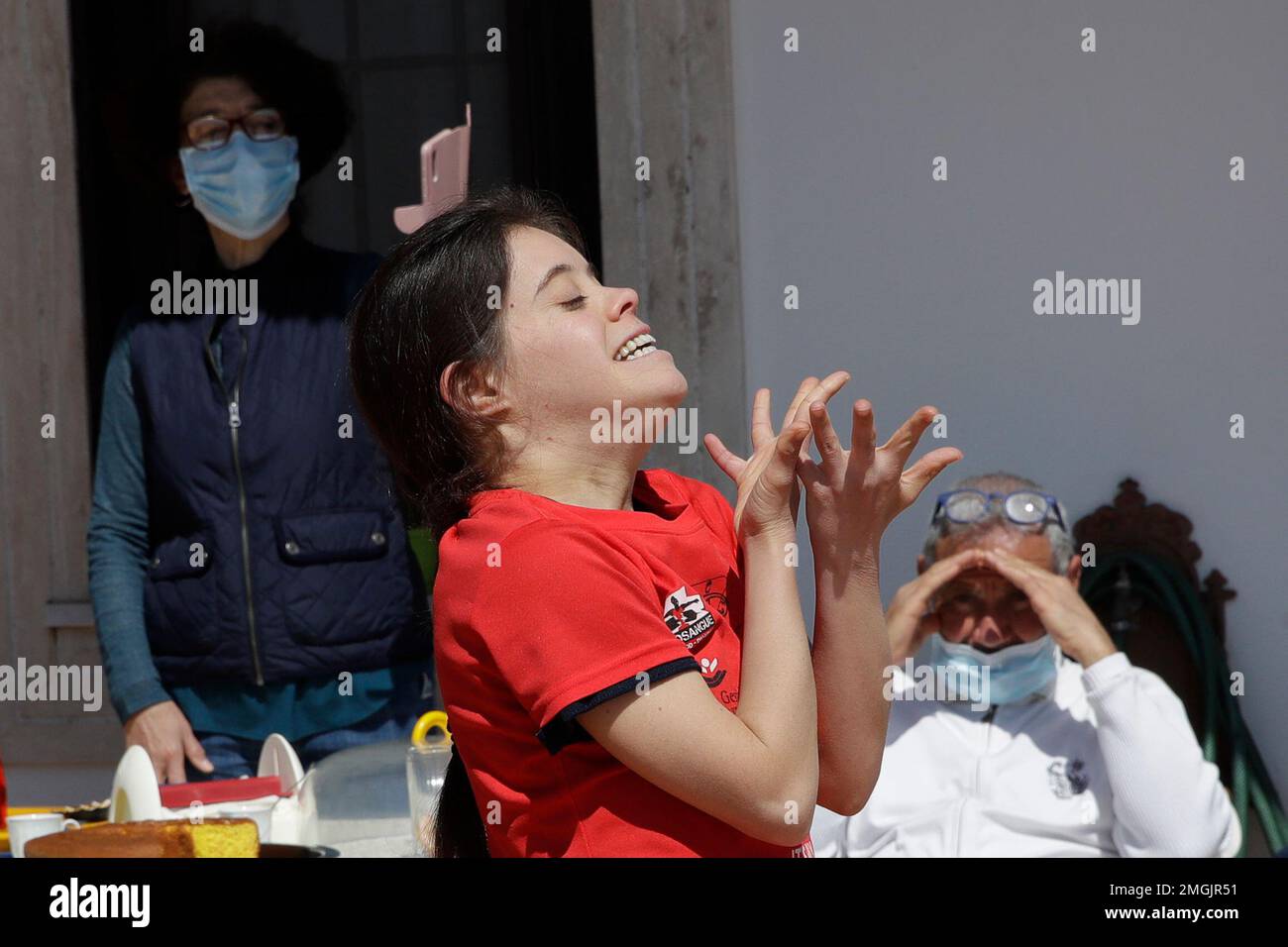 Laura Filipponi, left, flanked at right by her husband Valerio, plays ...