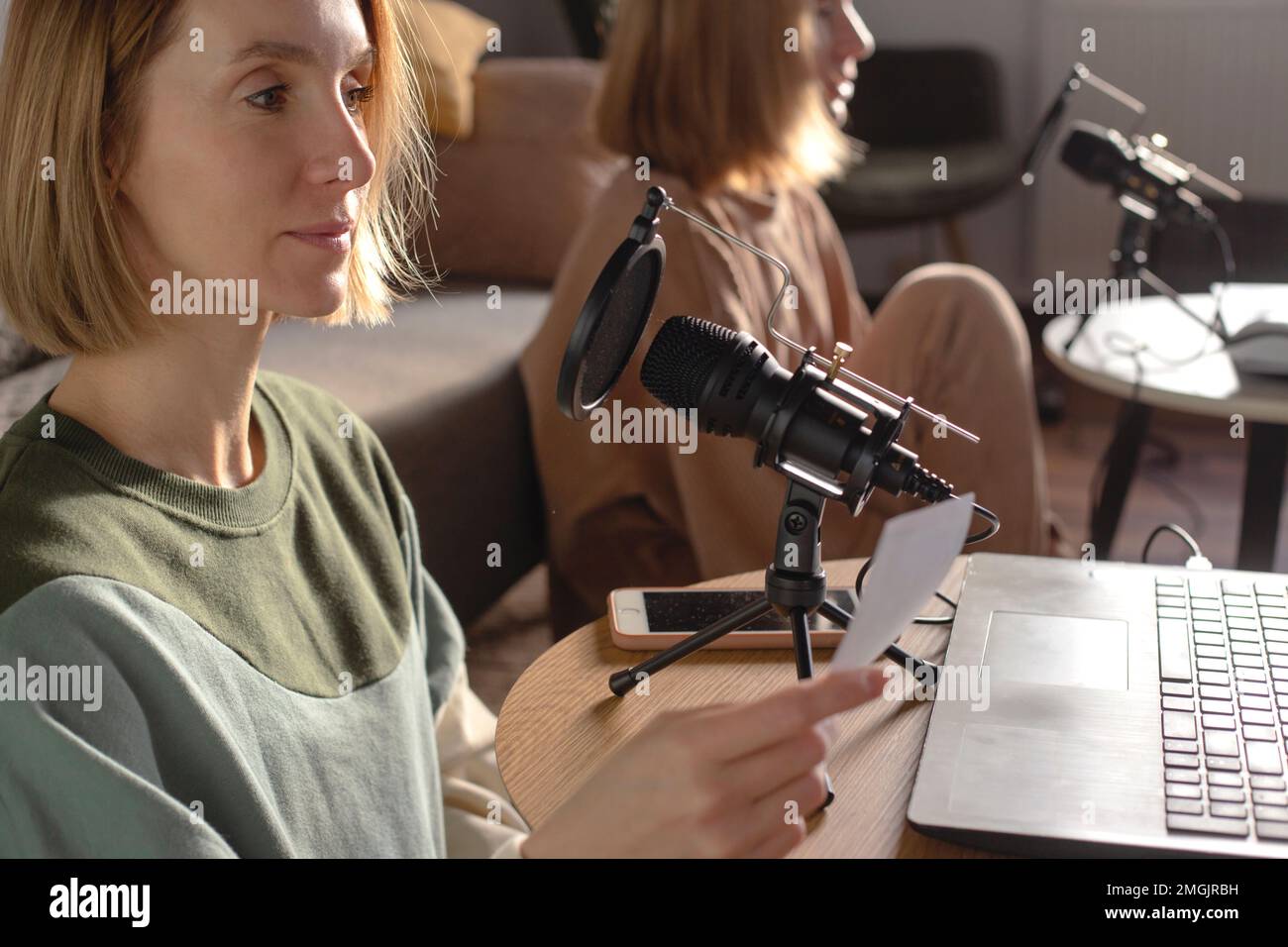 Two Female Podcast Producers Recording Together in a Home Studio Stock ...