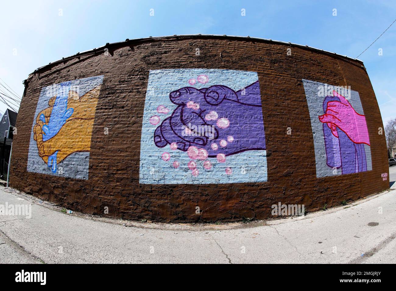 A mural depicting hand washing is seen in Logan Square by artist James ...