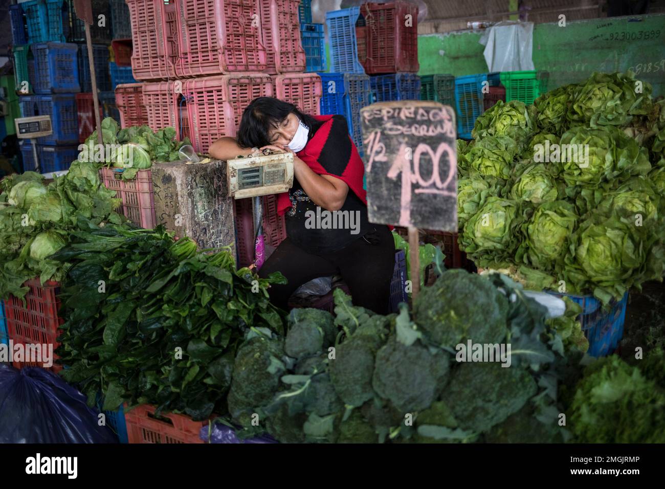 Kathy Velazquez, wearing a protective face mask as a precaution against ...