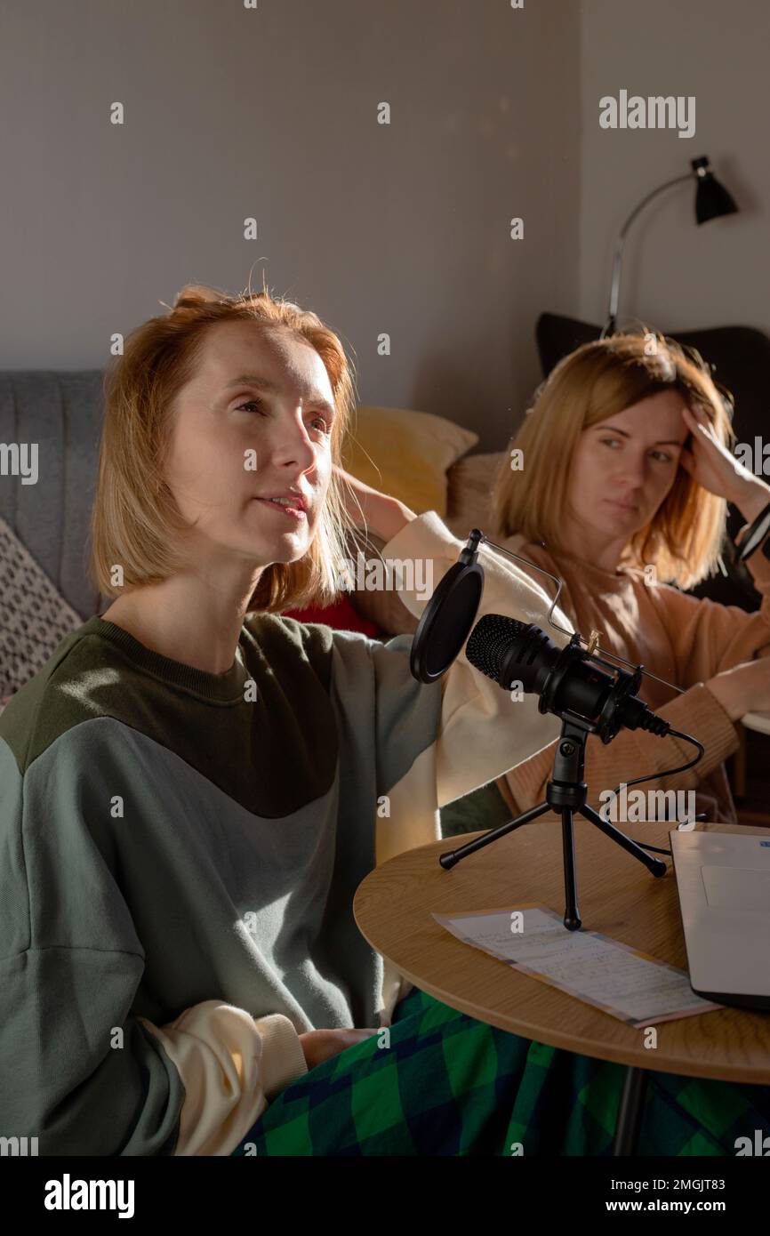 Collaborative Podcasting - Two Women Recording at Home Stock Photo - Alamy