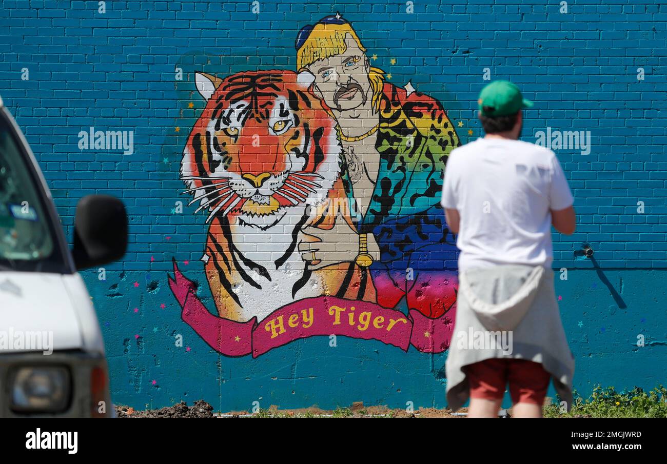 A man looks at a mural depicting Joseph Maldonado-Passage, also known ...