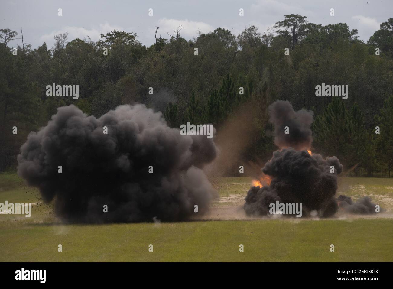 Two grapeshot demolition charges explode during a demolition range at ...
