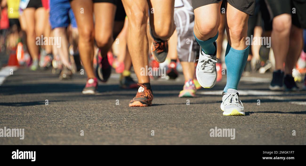 Marathon running race in the light of evening,running on city road ...