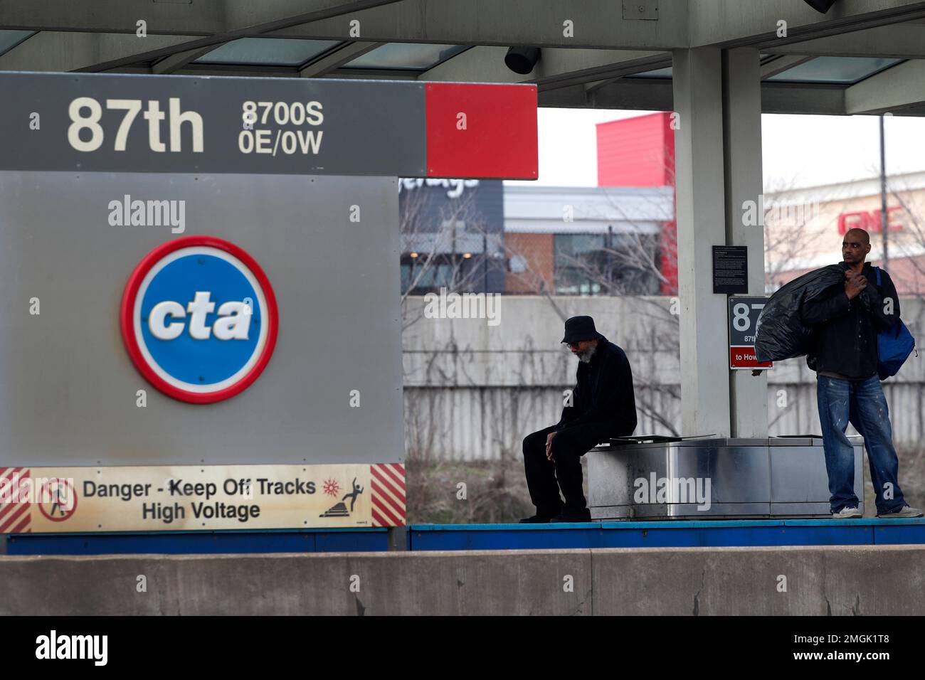 Two men wait for a Chicago Transit Authority Red Line train on Chicago ...