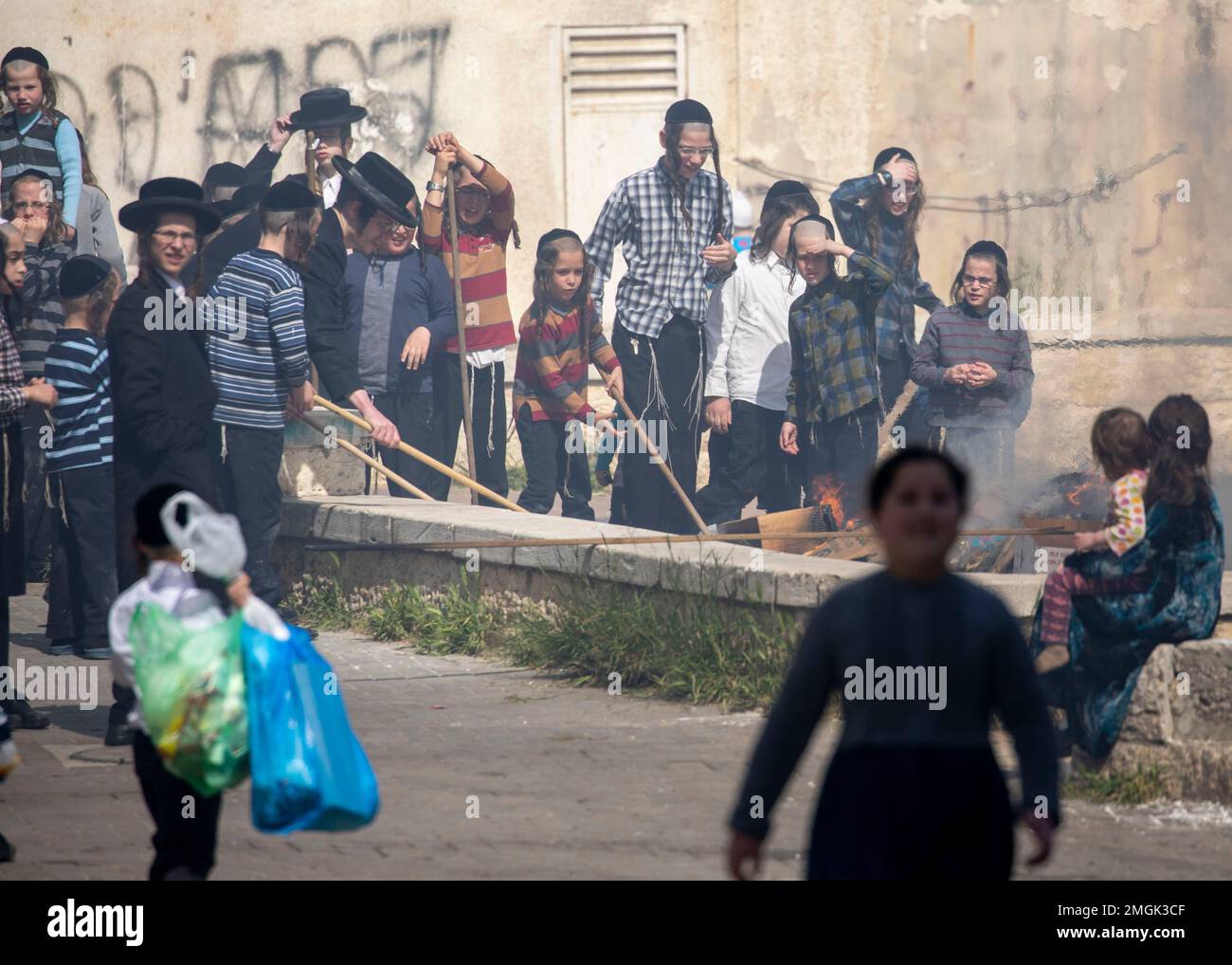 Ultra-Orthodox Jewish children burn leavened items in final preparation ...