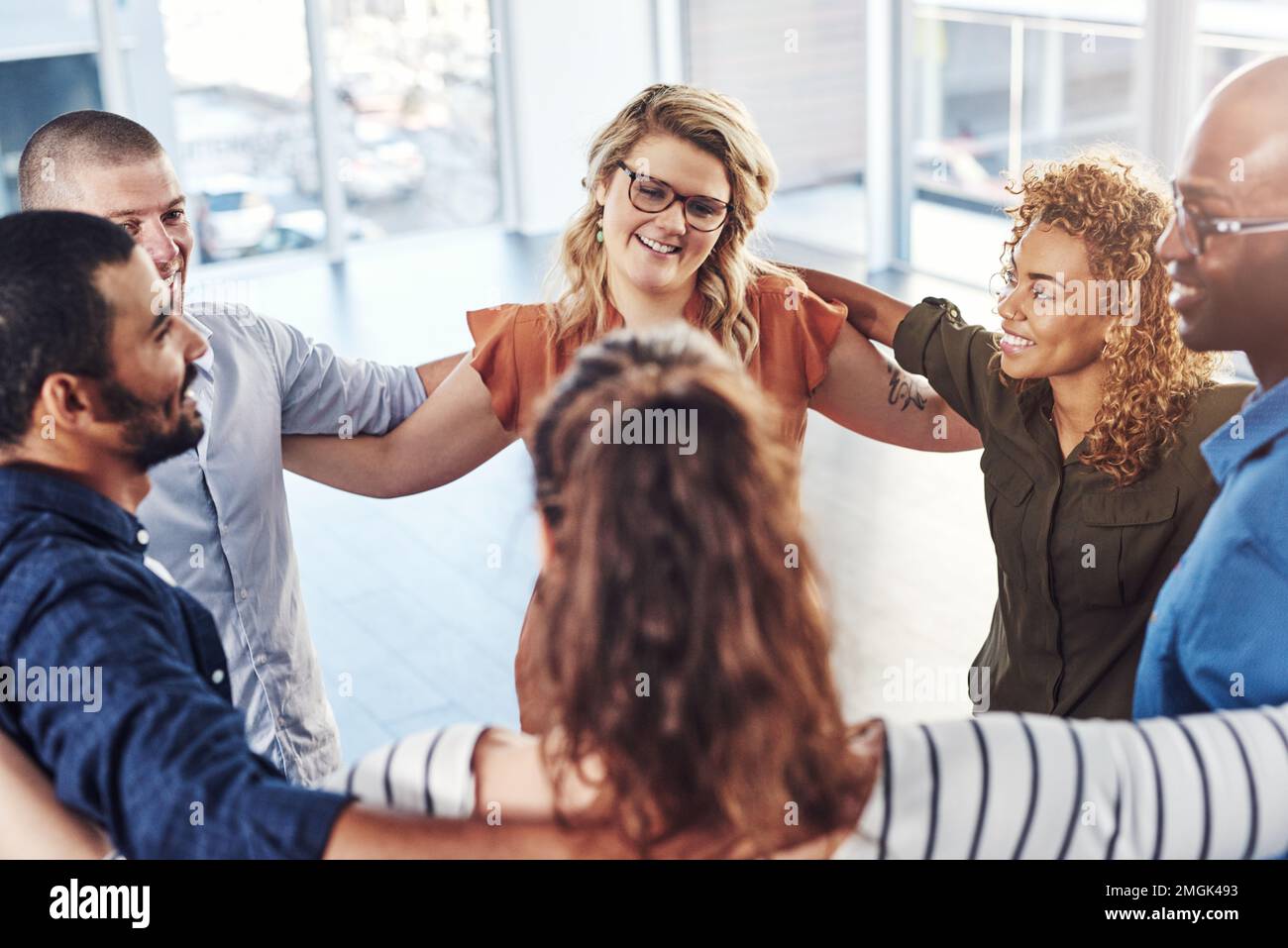Well always uplift each other. a group of people standing in a circle ...