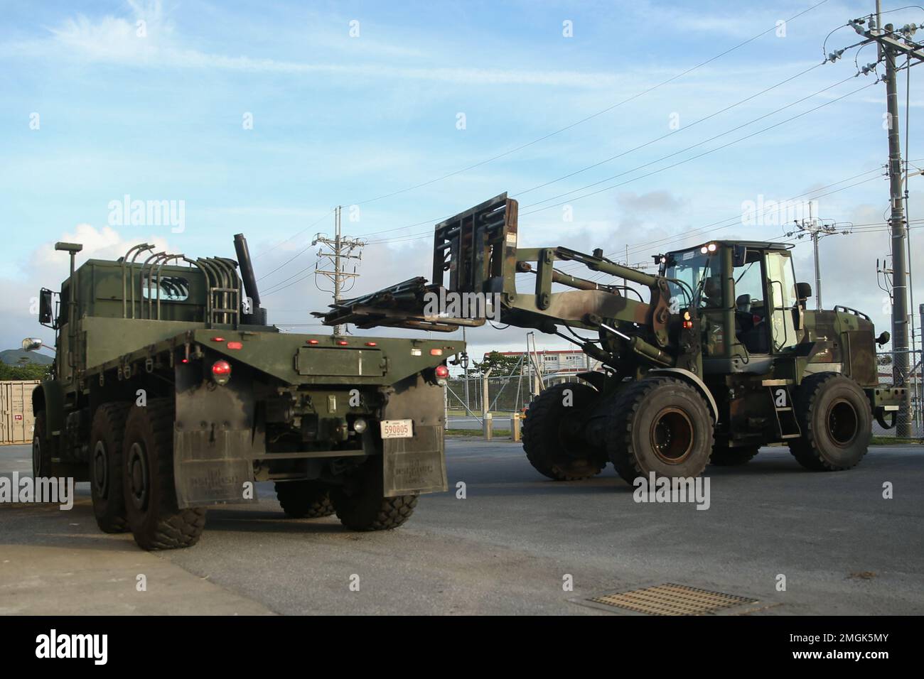 U.S. Marine Corps Lance Cpl. Devien Locke, an engineer equipment ...