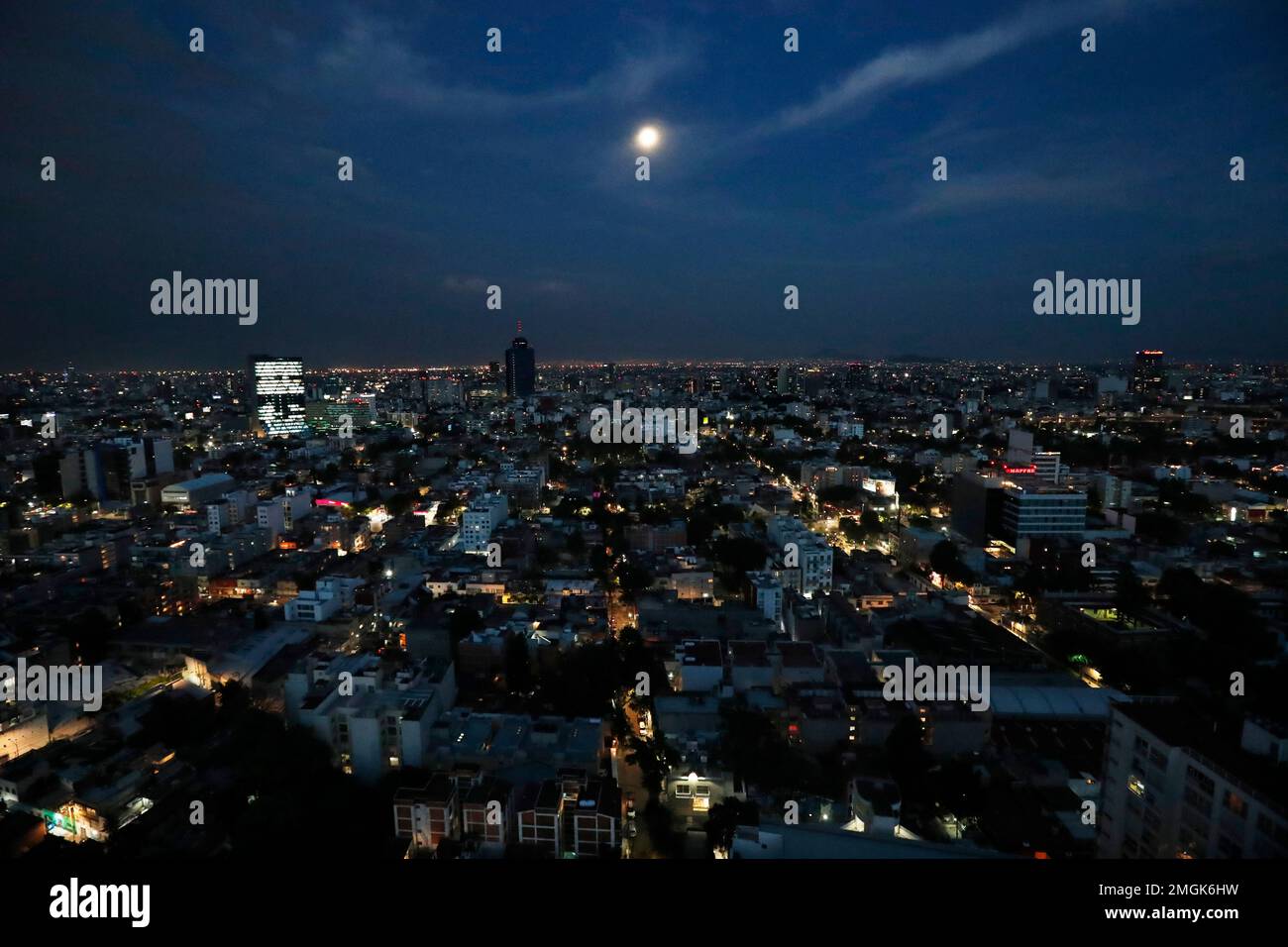 The moon rises over Mexico City, Monday, April 6, 2020. (AP Photo/Marco ...