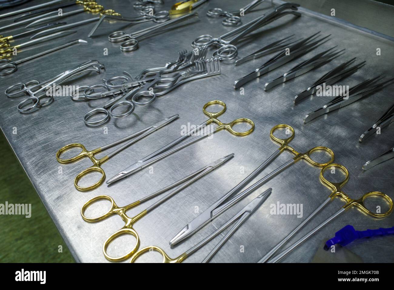 many different cleaned instruments for performing vascular surgery lie ...