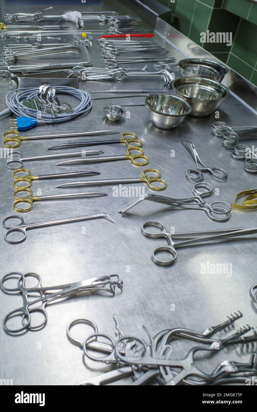 many different cleaned instruments for performing vascular surgery lie ...