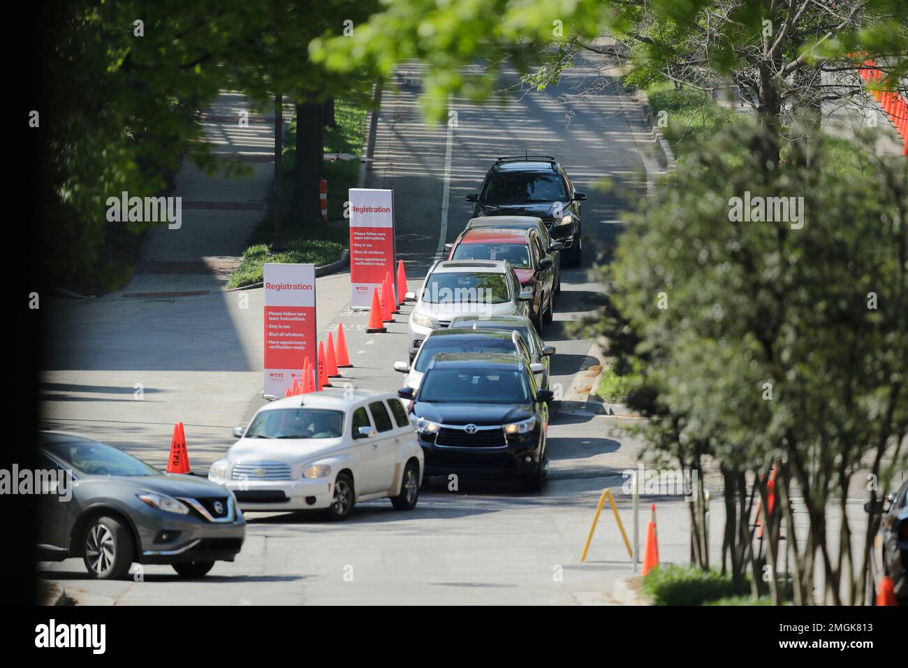 A line of cars gather to enter a COVID-19 testing site on Georgia Tech ...