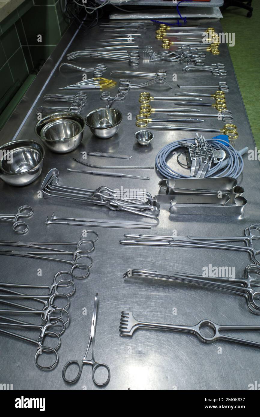 many different cleaned instruments for performing vascular surgery lie ...