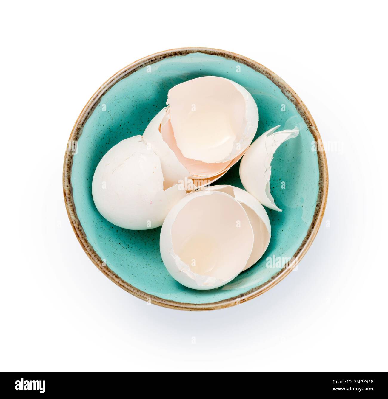 Blue bowl with eggshell isolated. Top view of eggshell in bowl on white ...