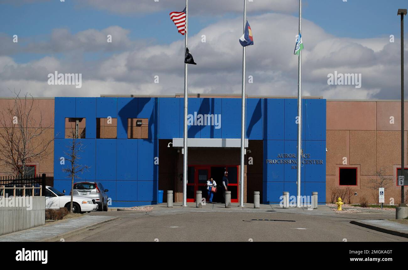 Visitors walk out of the GEO Detention Center Friday, April 3, 2020, in ...