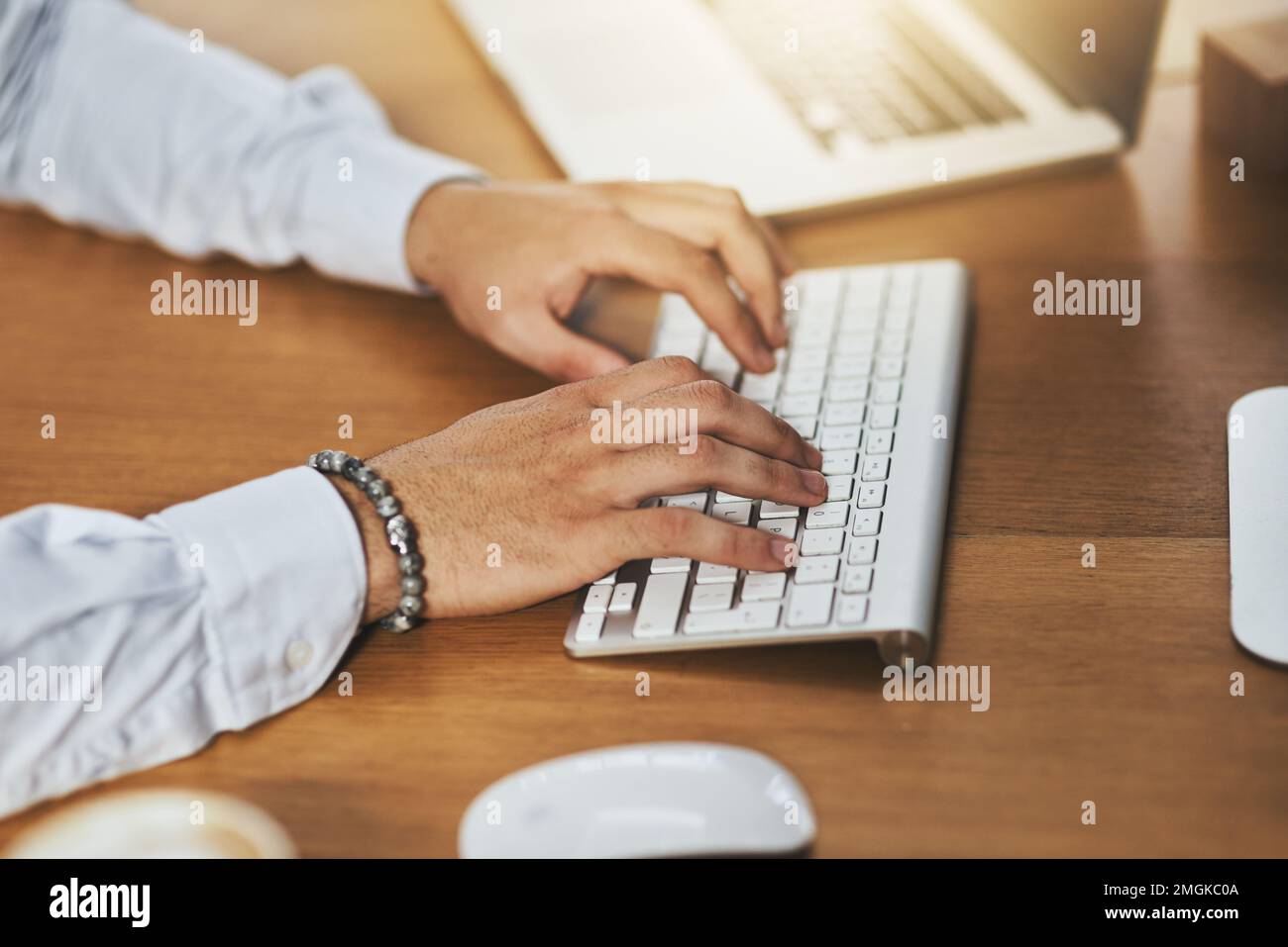 Hes got a lot of typing to do. Closeup shot of an unrecognisable ...