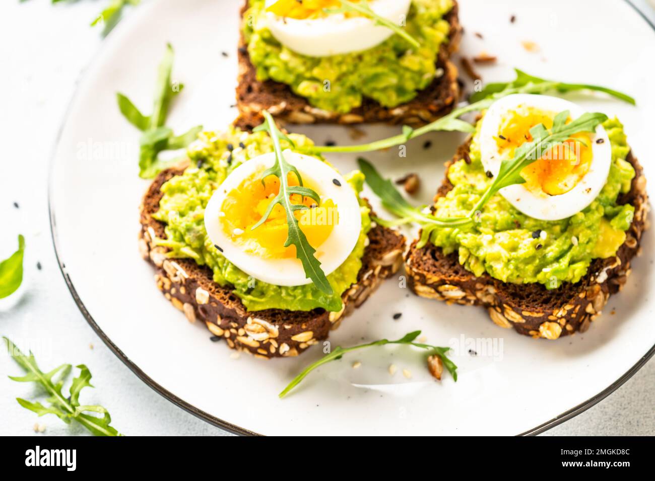 Whole grain bread with avocado and boiled eggs Stock Photo - Alamy