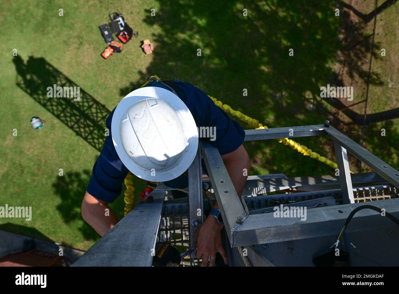 A Coast Guard member from ANT Hampton performs navigation light ...