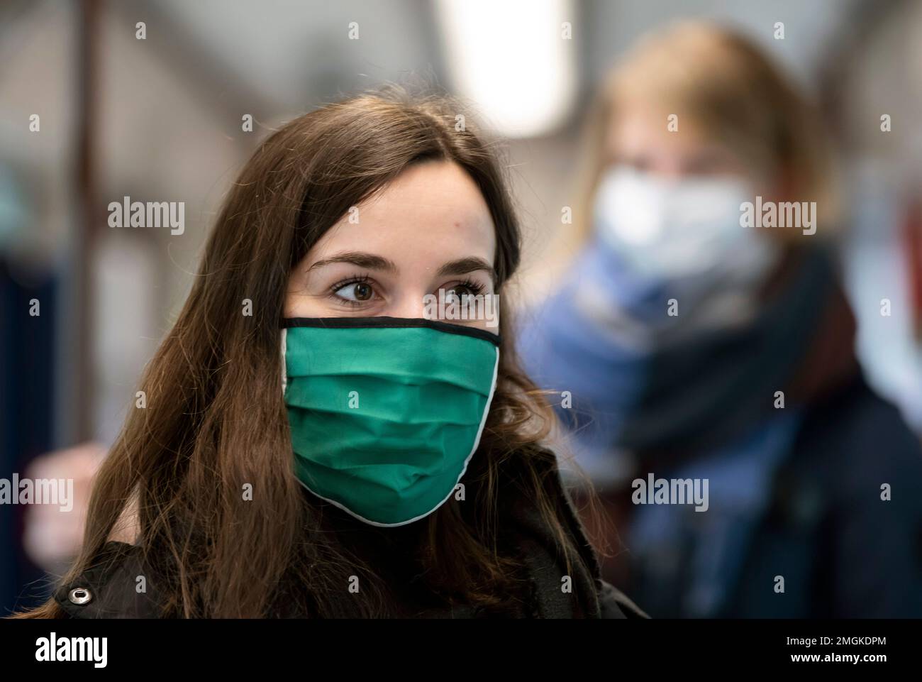 Women wearing face masks in a tramway during a media presentation in ...