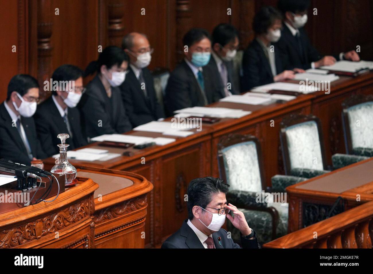 Japanese Prime Minister Shinzo Abe wearing a protective face mask ...