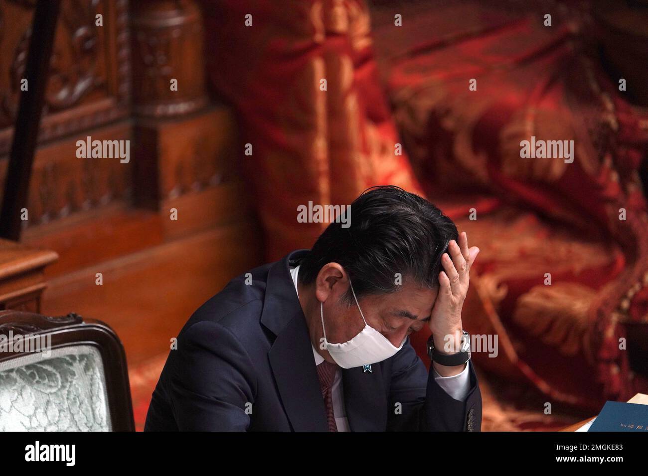 Japanese Prime Minister Shinzo Abe wearing a protective face mask ...