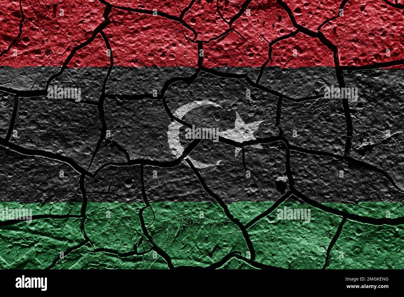 Libya flag on a mud texture of dry crack on the ground Stock Photo - Alamy