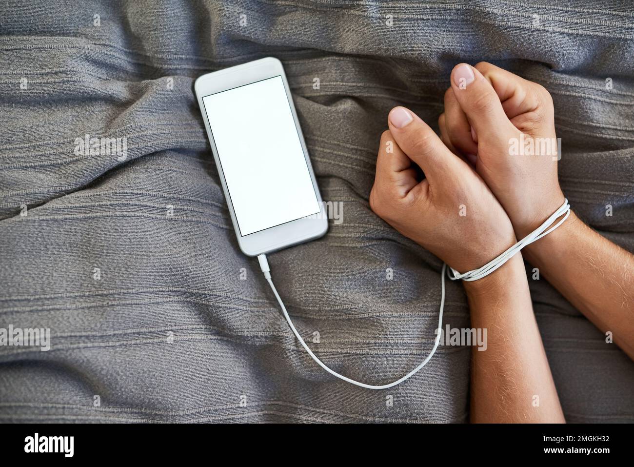 Chained to technology. High angle shot of an unrecognizable persons ...
