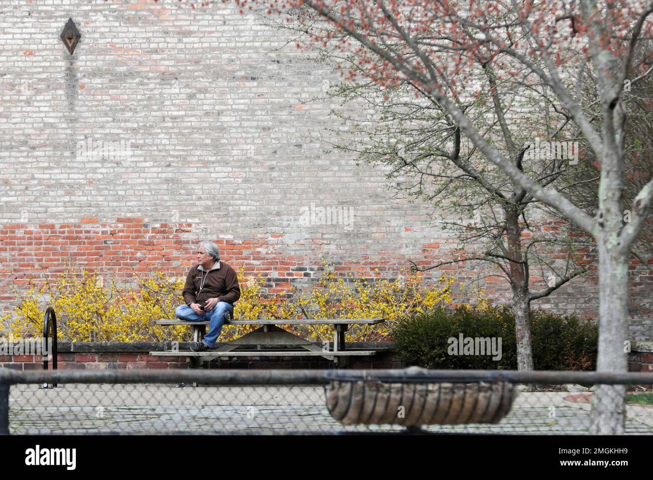 Alex Chavez spends a quiet moment on a picnic table, Wednesday, April 1 ...