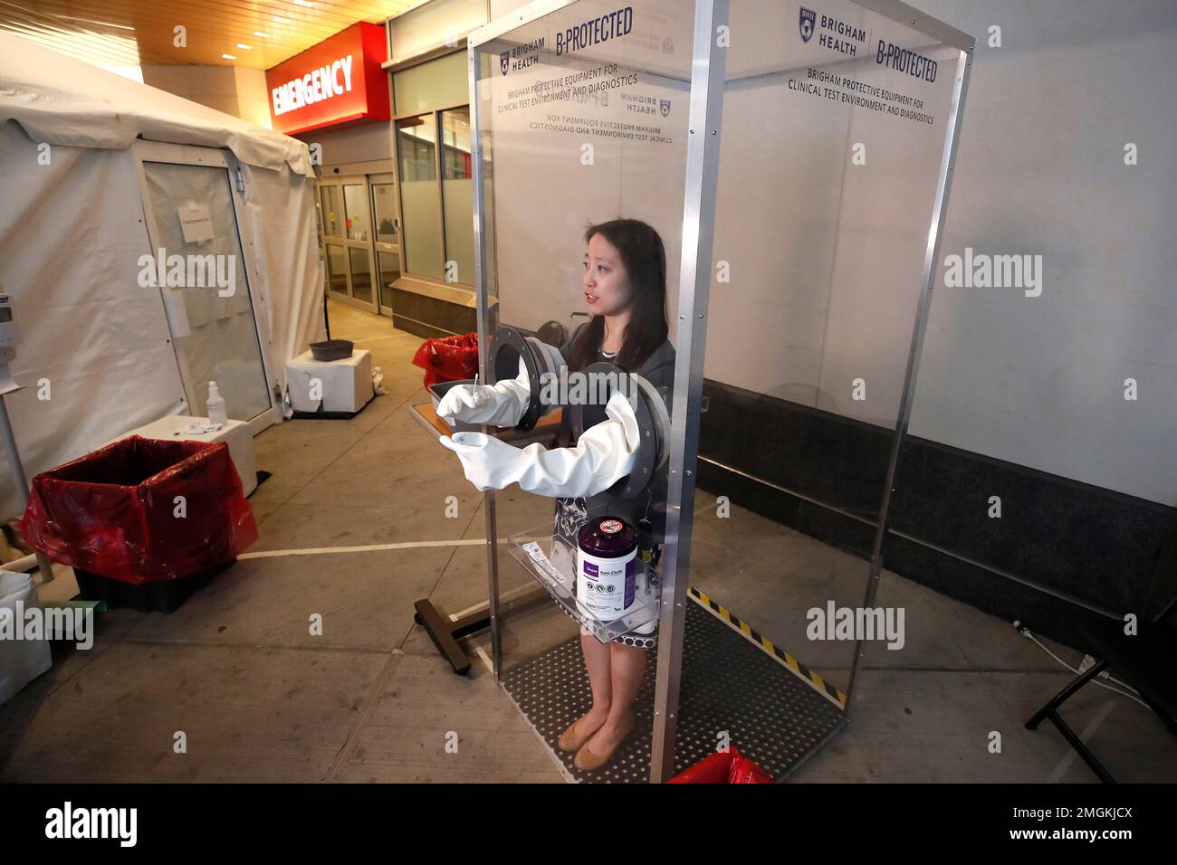 Dr. Sherry Yu demonstrates a free-standing booth for COVID-19 testing ...