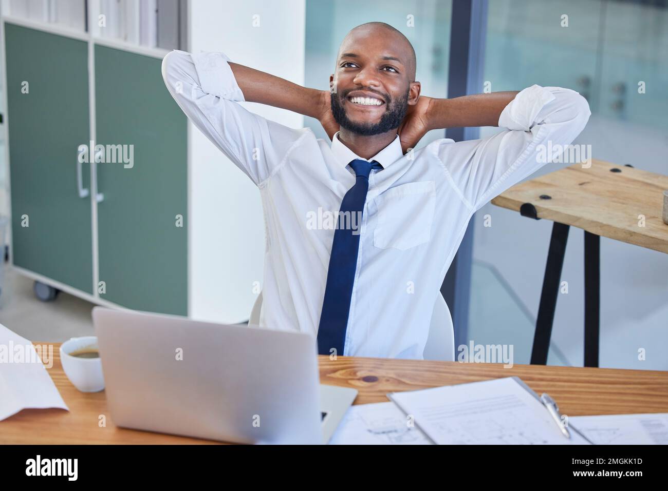 Business laptop, black man and relax in office after finishing project ...