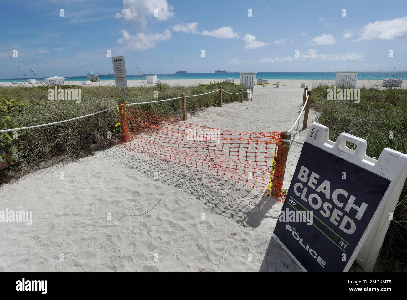An entrance to a beach is closed, Tuesday, March 31, 2020, in Miami ...