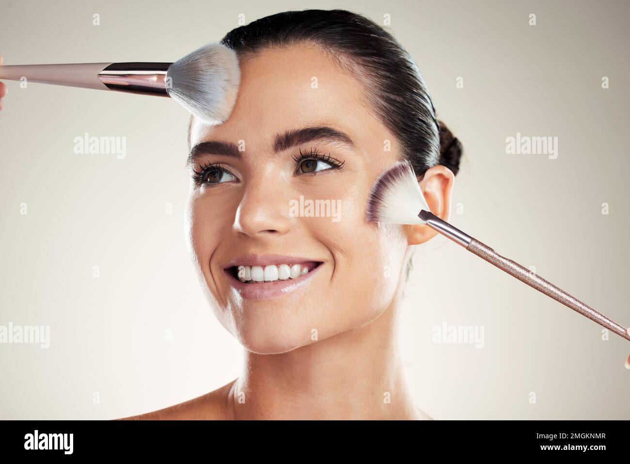 Makeup brush, beauty and face of a woman in studio with a smile for ...