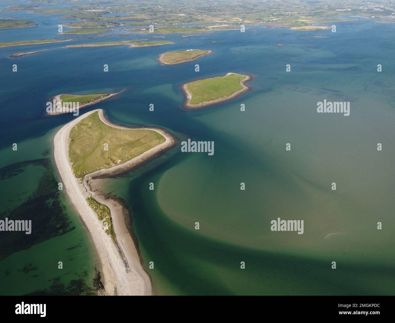 An aerial view of a sea sandbar in the middle of the transparent sea ...