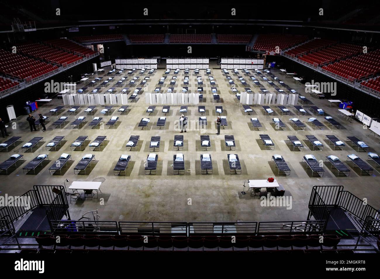 Beds are set out in rows at the Federal Medical Station for hospital ...