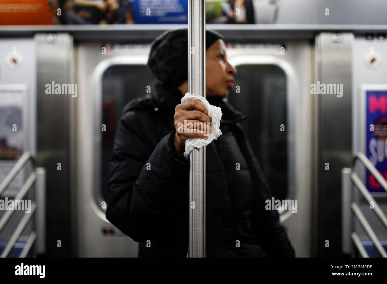 Holding subway pole hi-res stock photography and images - Alamy