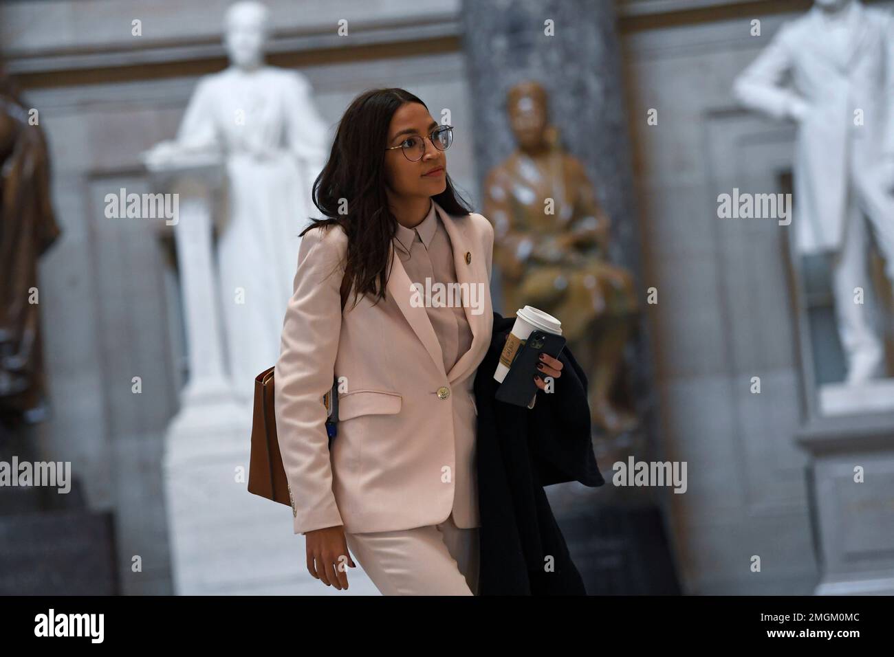 Rep. Alexandria Ocasio-Cortez, D-N.Y., walks Capitol Hill in Washington ...