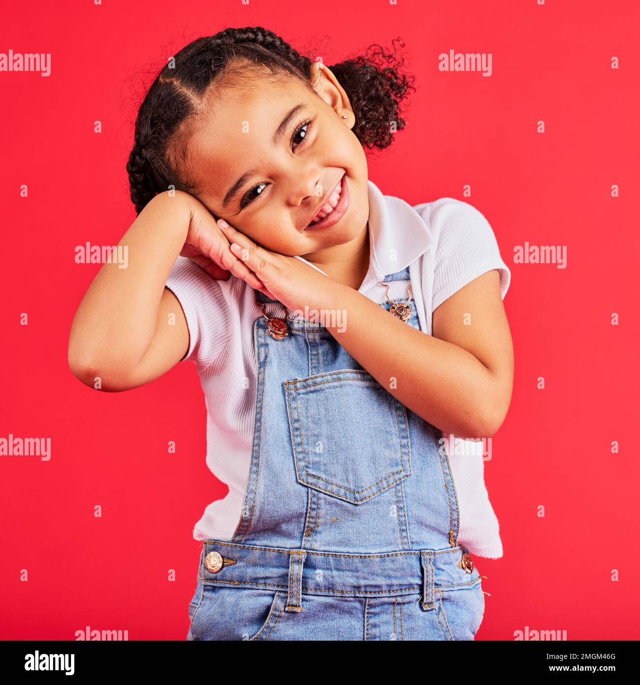 Happy, smile and cute young girl child portrait with red studio ...
