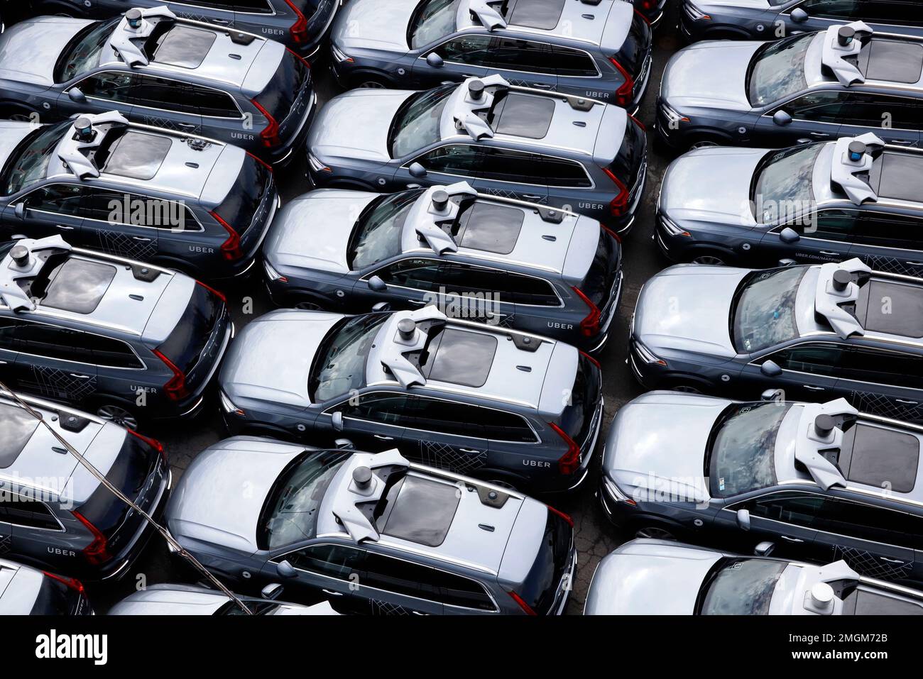 This March 20, 2020, photo shows a parking lot full of Uber self ...