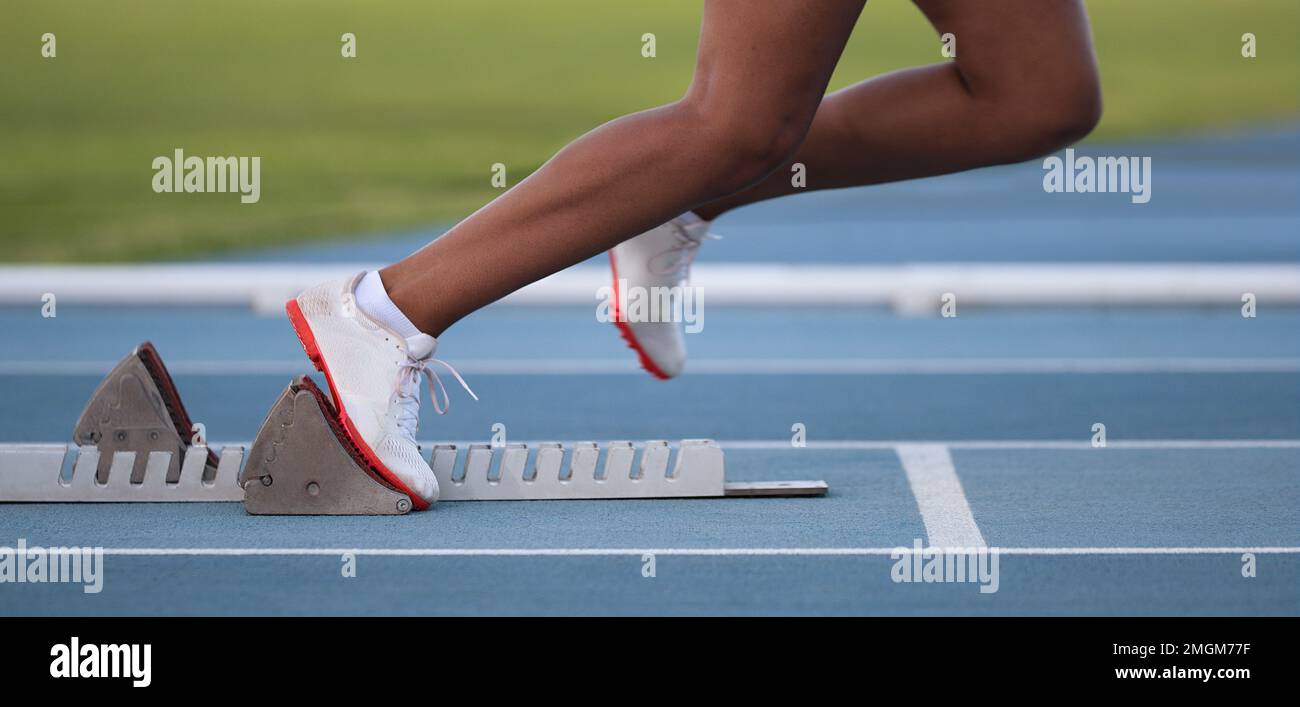 Female sprinter leaving starting blocks hi-res stock photography and ...