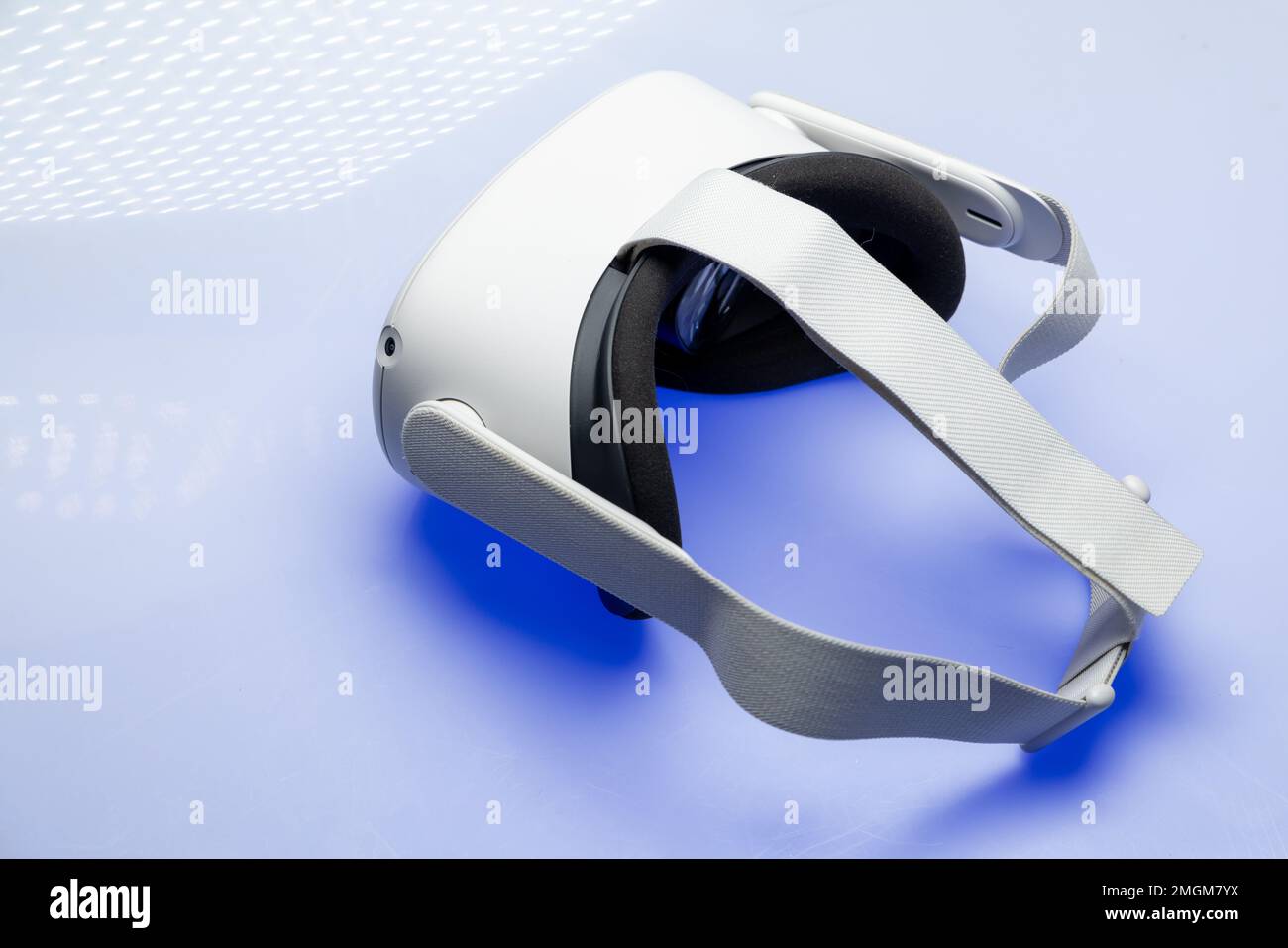 White new generation VR headset isolated on white background with blue ...