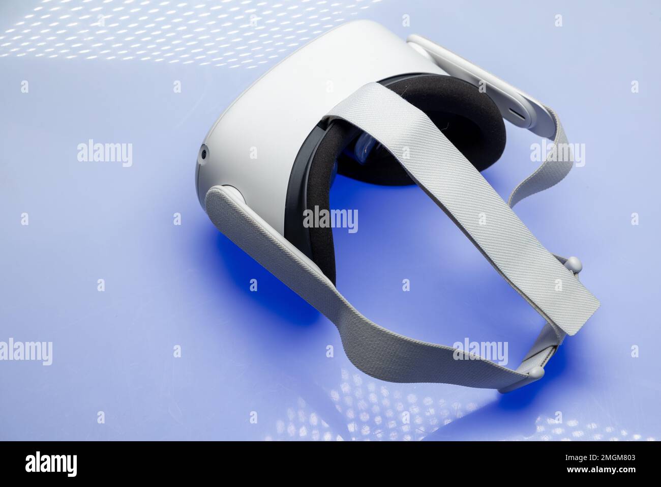 White new generation VR headset isolated on white background with blue ...