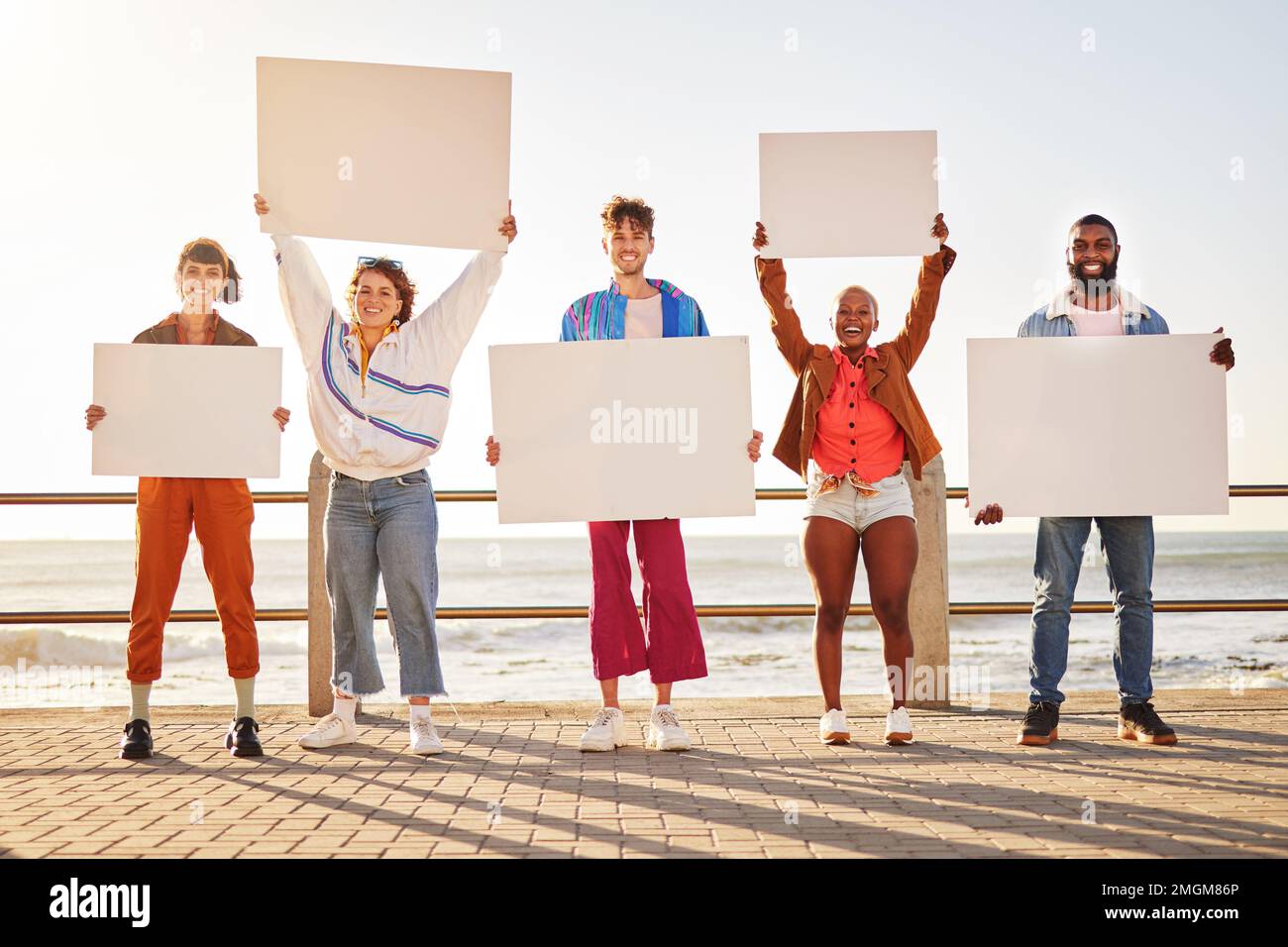 Portrait, poster and diversity with friends together holding signage in ...