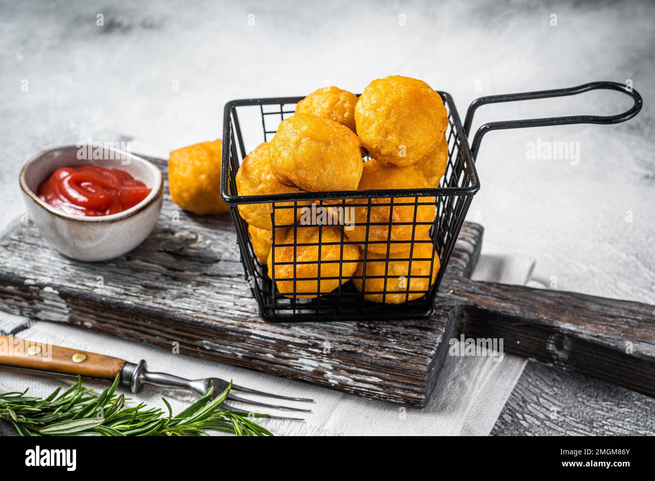 Fried Potato Cheese Balls Croquettes With Tomato Ketchup Served In A Basket White Background