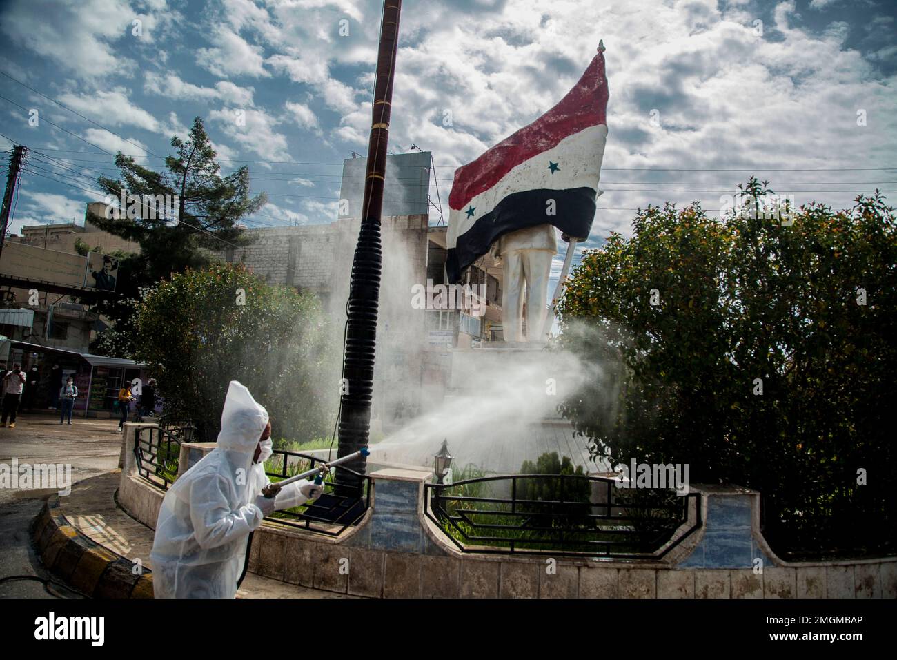 Workers disinfect the streets to prevent the spread of coronavirus in ...