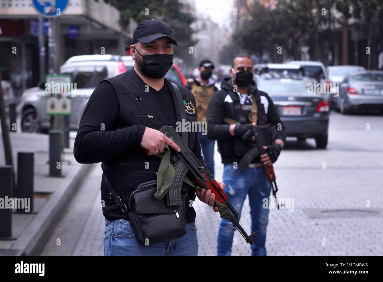 Lebanese intelligence officers deploy on a street to urge people to ...